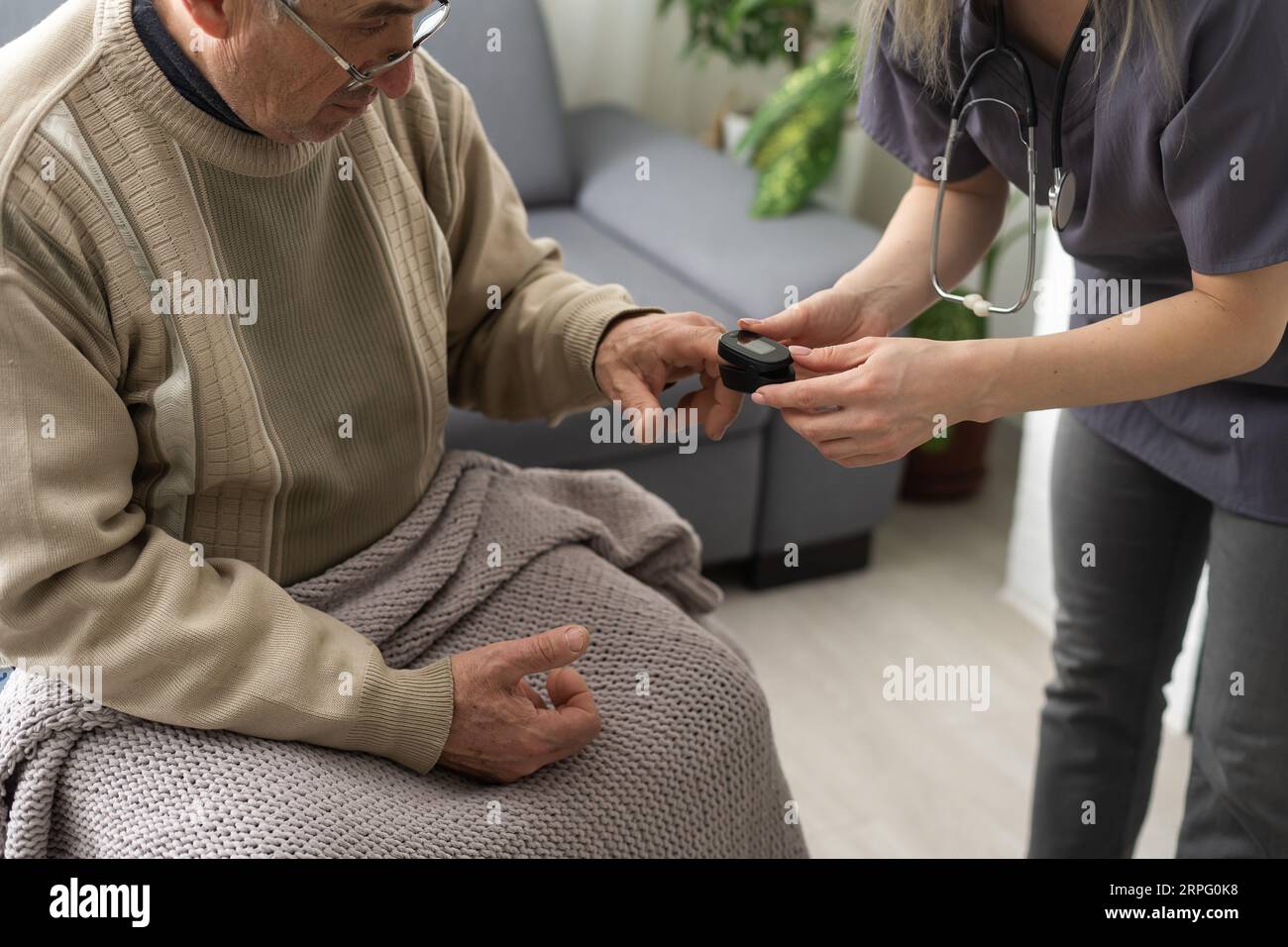 Nurse use pulse oximeter to check patient's oxygen in home , Home ...