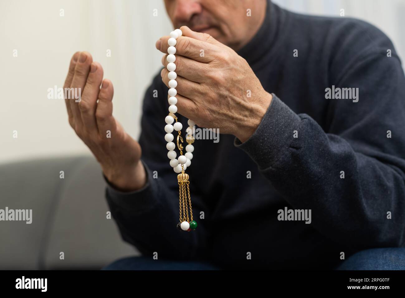 Elderly Muslim Arabic man praying Stock Photo - Alamy