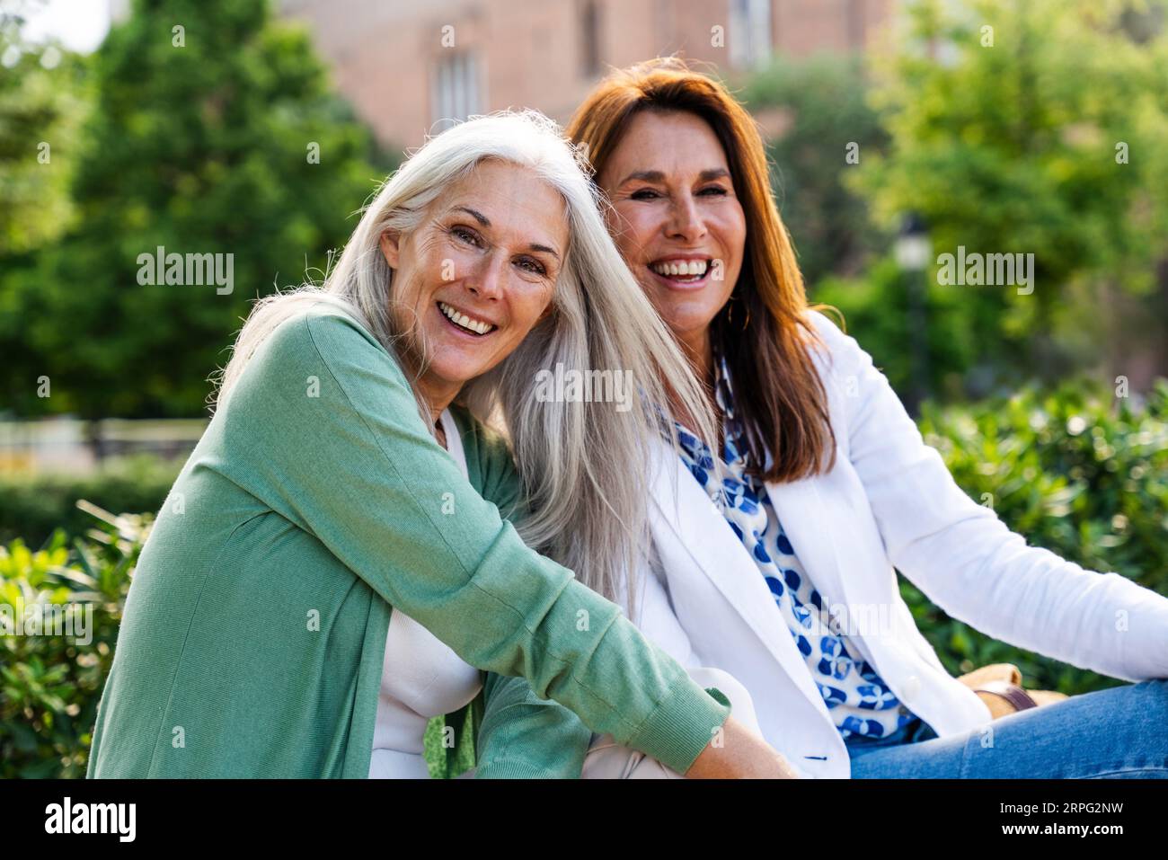 Beautiful senior women bonding outdoors in the city - Attractive ...