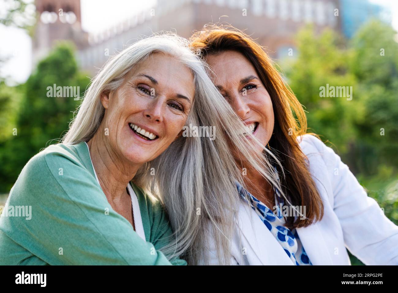 Beautiful senior women bonding outdoors in the city - Attractive ...