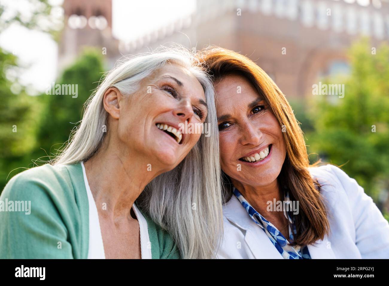 Beautiful senior women bonding outdoors in the city - Attractive ...