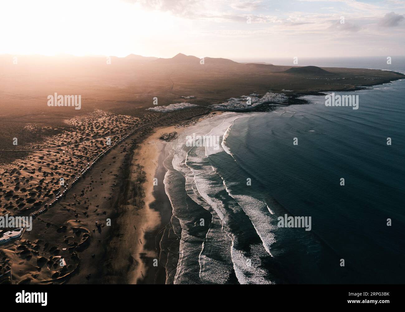 Aerial photo of sunset on Caleta de Famara in Canary Islands ...