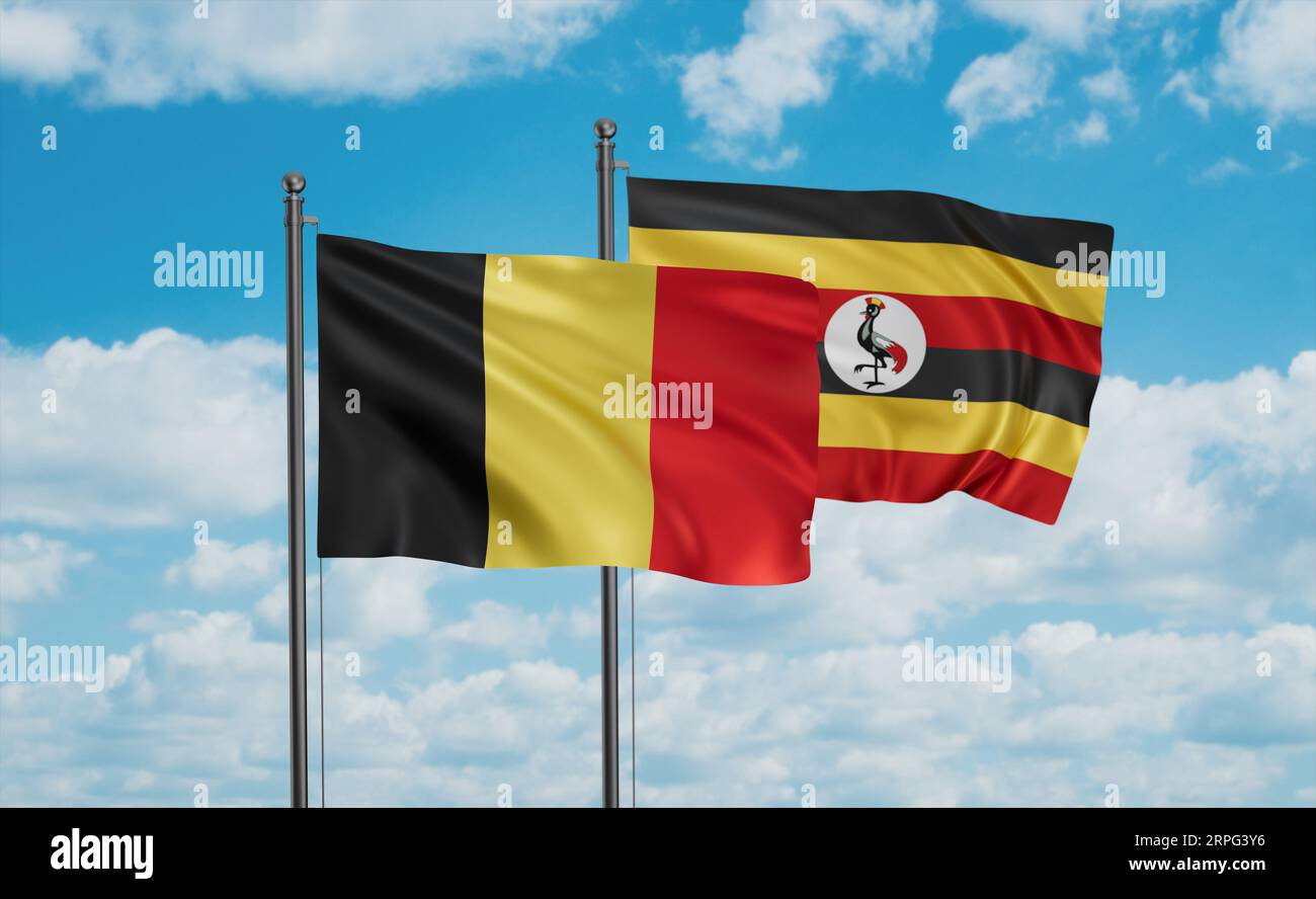 Republic of Uganda and Belgium flag waving together in the wind on blue ...