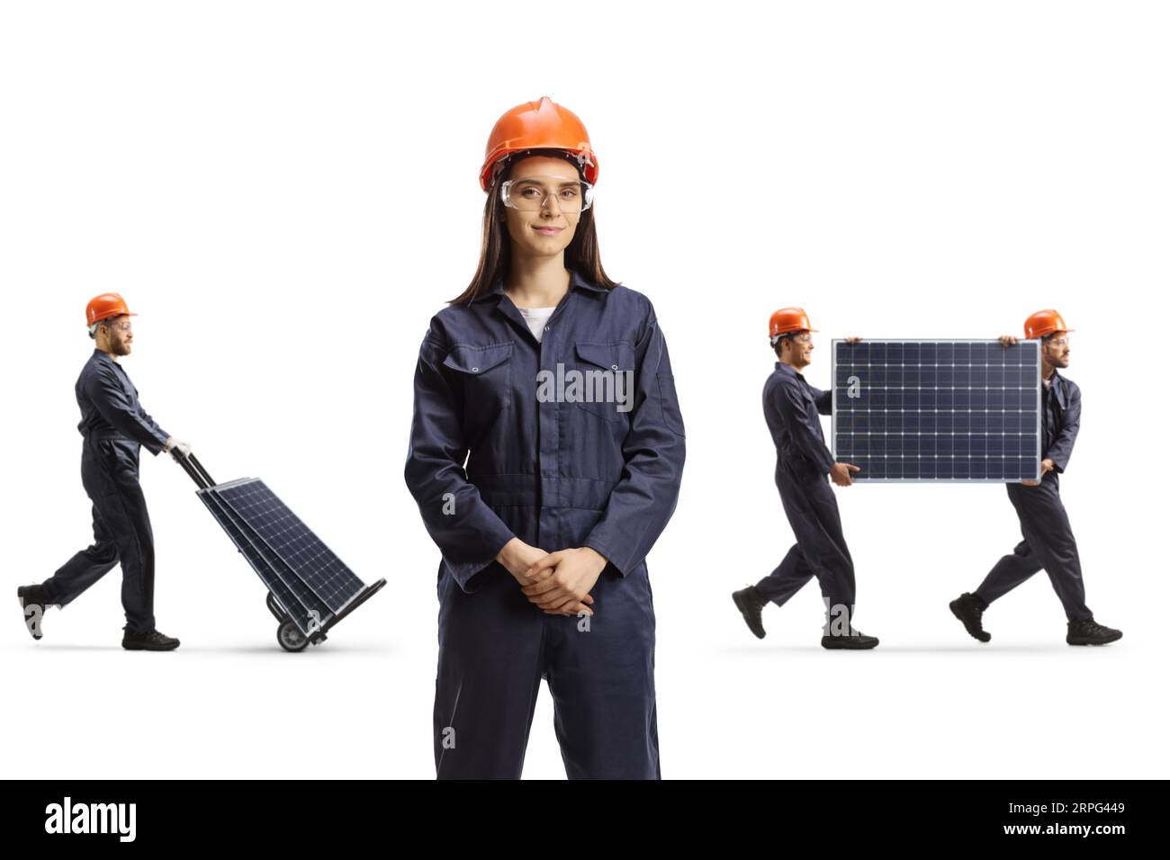 Female factory worker posing in the front and men carrying ...