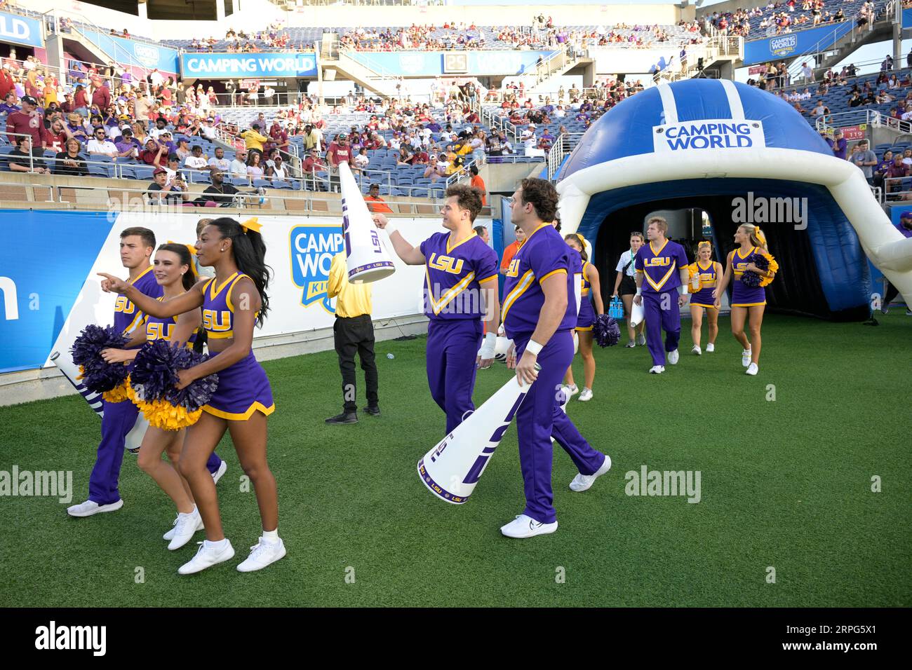 LSU cheerleaders enter the field before an NCAA college football game ...
