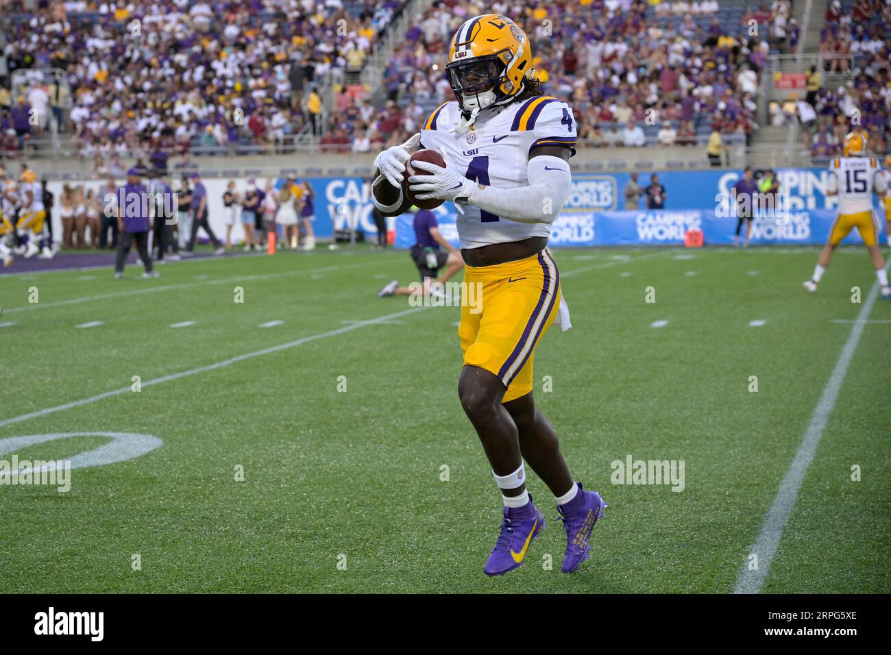 LSU linebacker Harold Perkins Jr. (4) warms up before an NCAA college ...