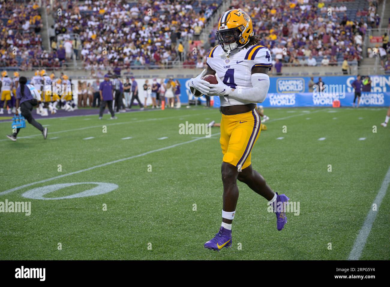 LSU linebacker Harold Perkins Jr. (4) warms up before an NCAA college ...