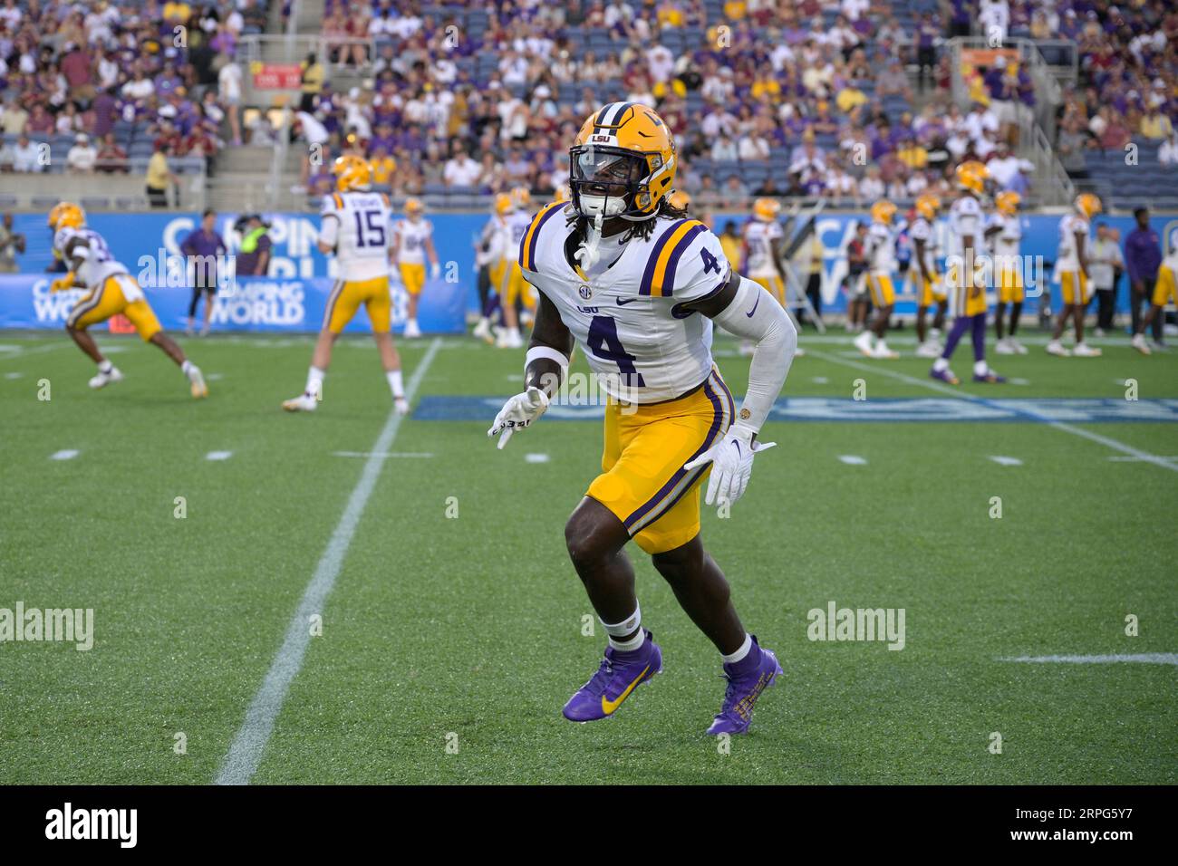 LSU linebacker Harold Perkins Jr. (4) warms up before an NCAA college ...