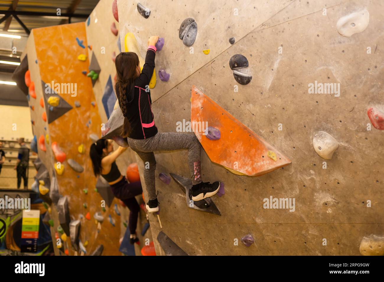 teenager climbing a rock wall Stock Photo - Alamy