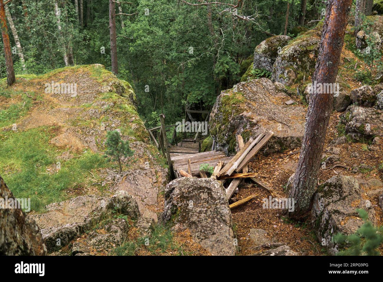 ruined wooden staircase on an abandoned path in a mountain forest Stock ...