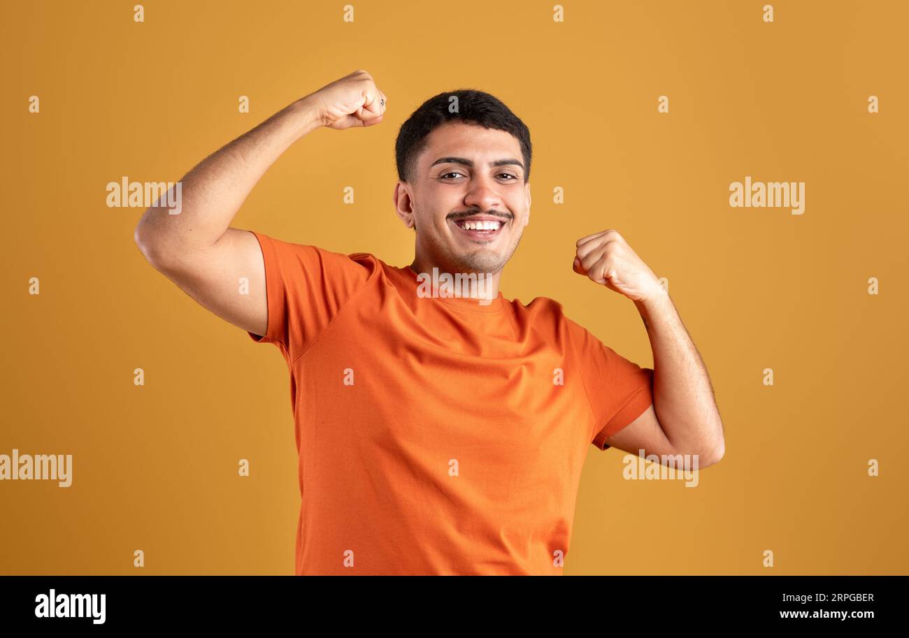 Person wearing orange shirt hi-res stock photography and images - Alamy