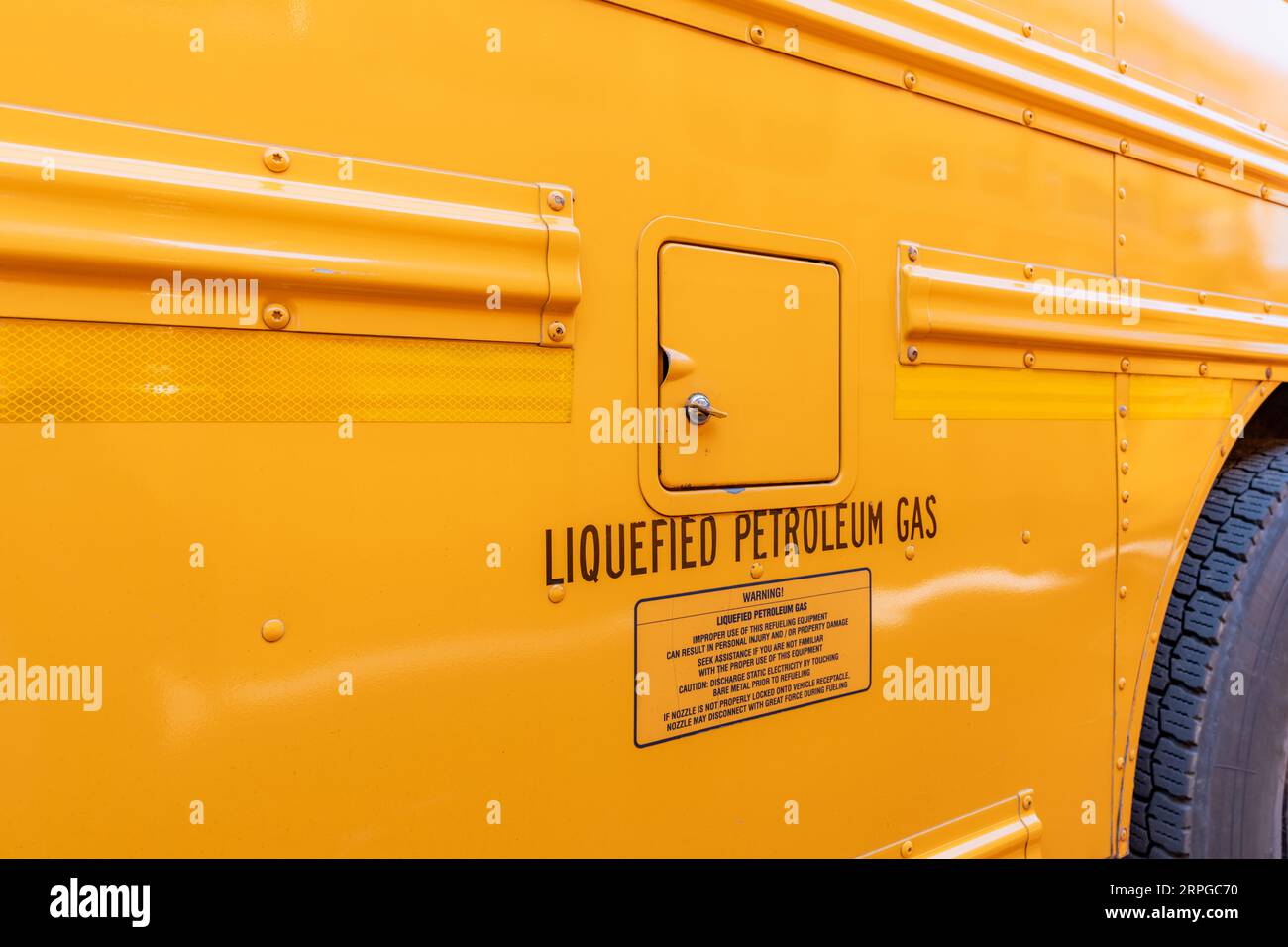 Side of a parked yellow LPG, Liquefied Petroleum Gas, school bus Stock ...