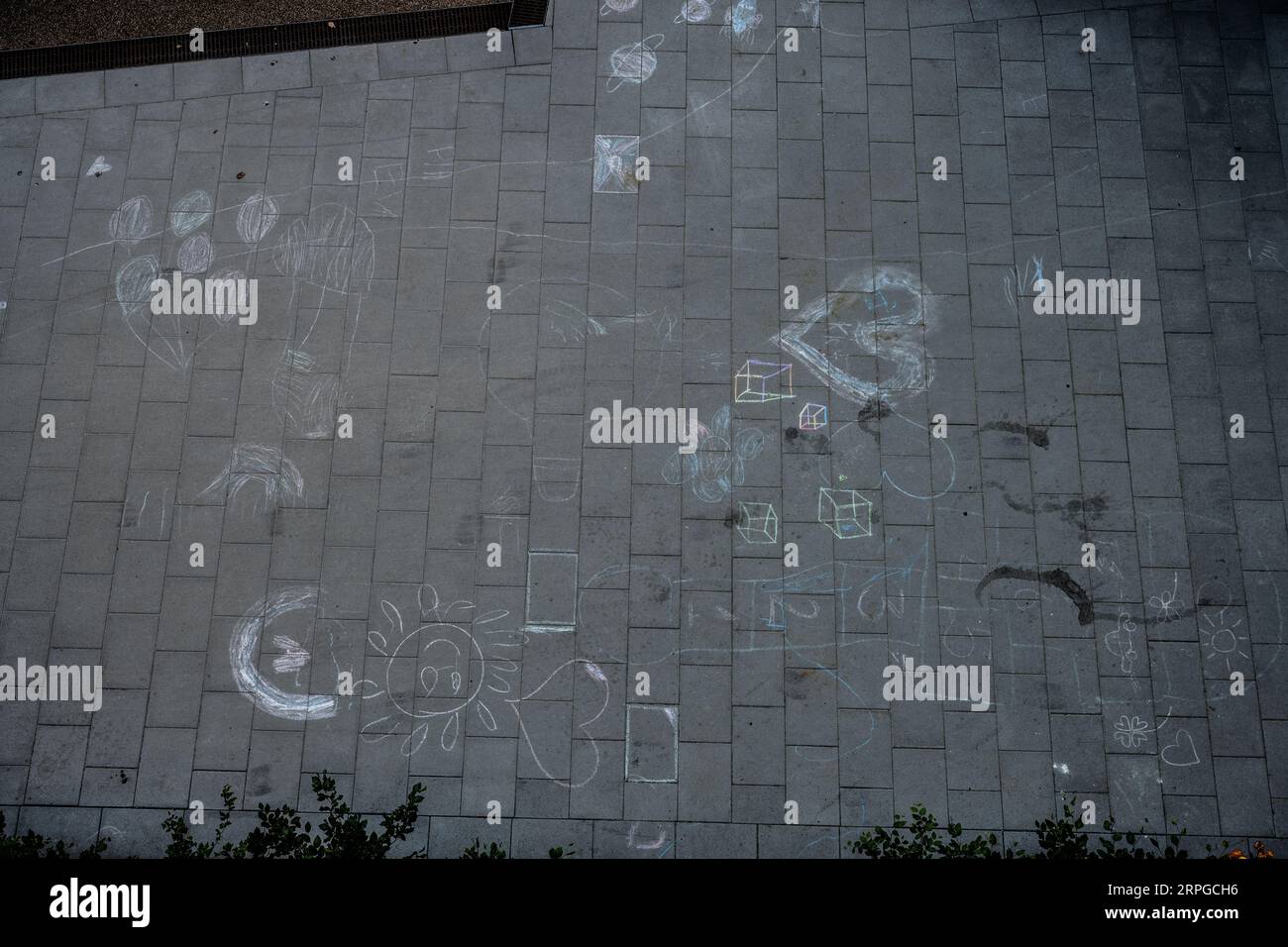 Chalk drawings on stome pavement below apartment buildings Stock Photo ...