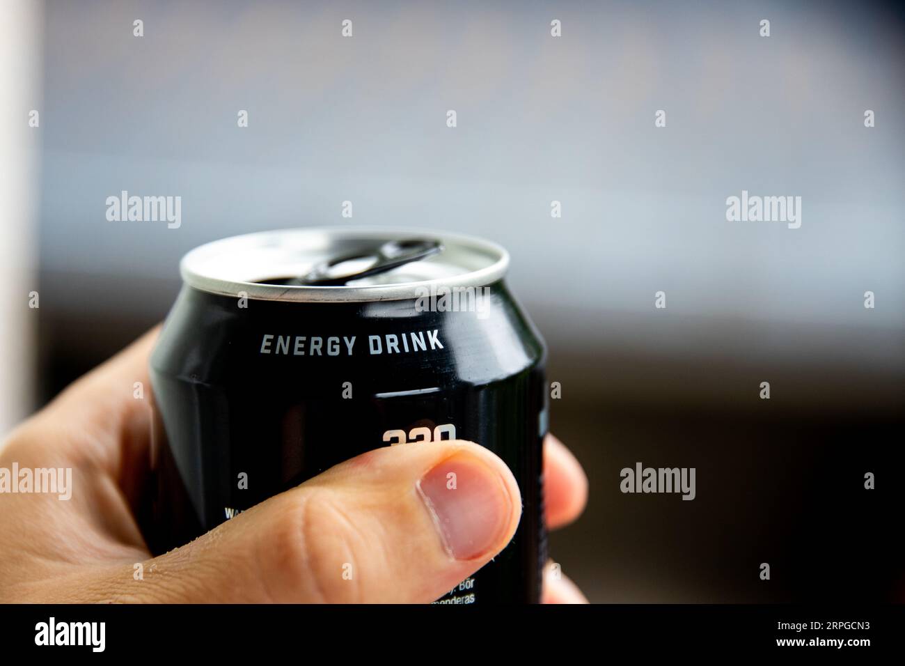 Hand holding can alcohol hi-res stock photography and images - Alamy