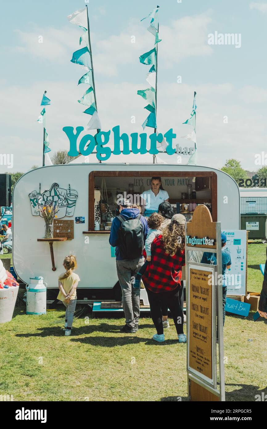 People wait in line at "Yoghurt" food truck at Rollende Keukens food ...
