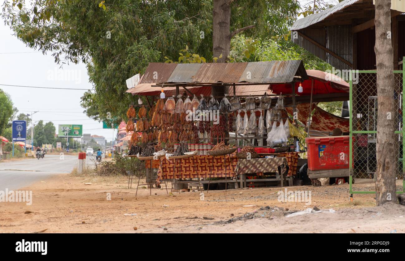 An expansive view of a rural landscape featuring a series of poles with ...