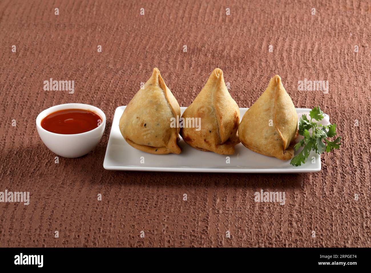 Samosa green background hi-res stock photography and images - Alamy