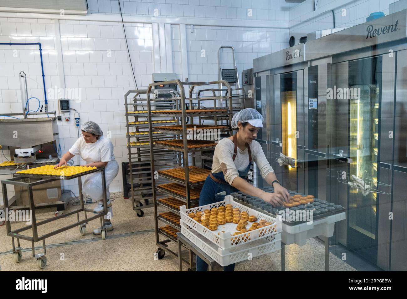 Women bakers prepare queijadas, a traditional custard pastry, at the Queijadas do Morgado bakery ...