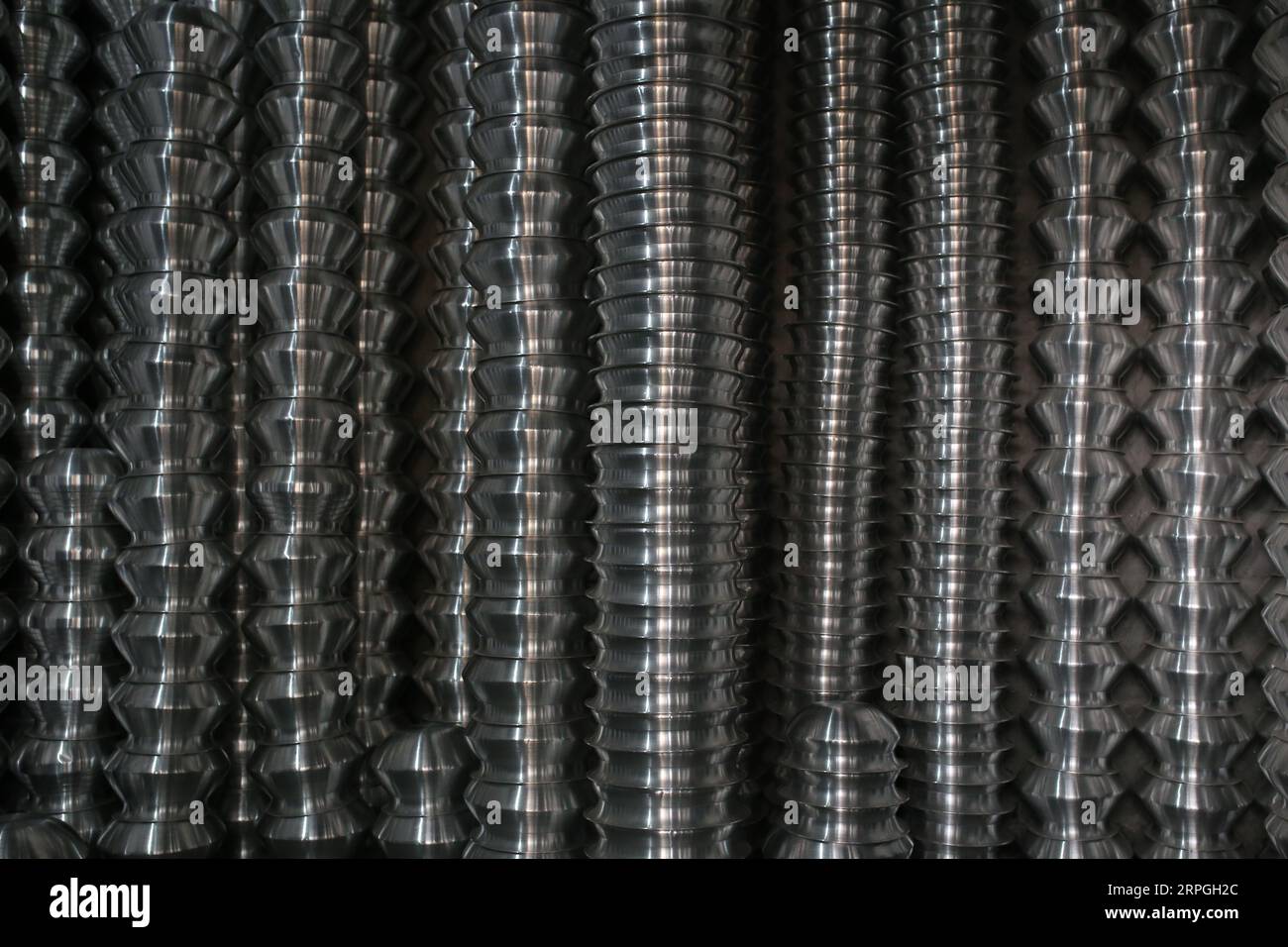 Cooking Pots in rows in a aluminium factory Stock Photo - Alamy