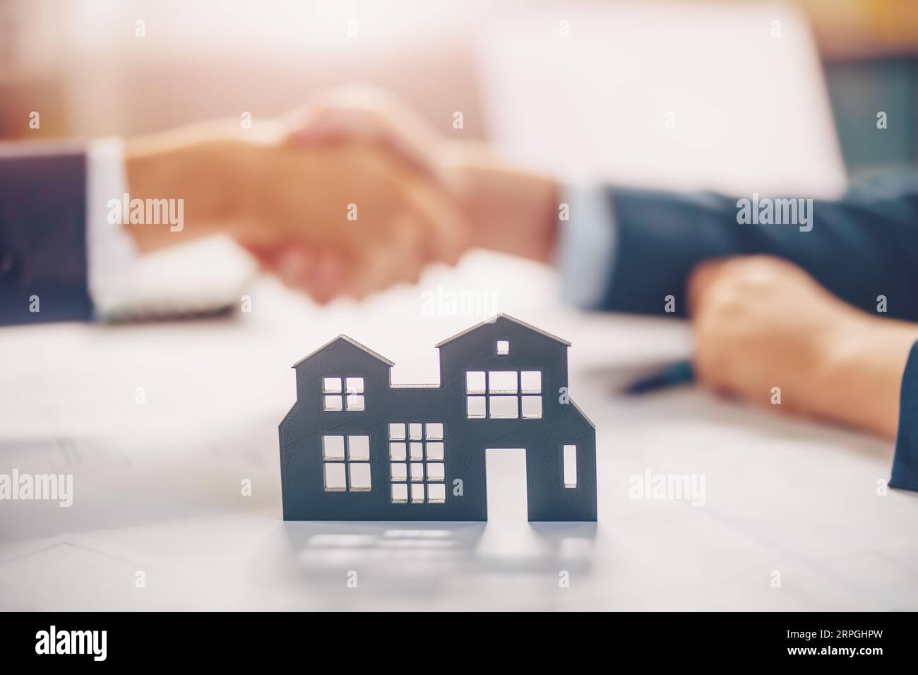Handshake between two people concluding a contract for the sale of ...