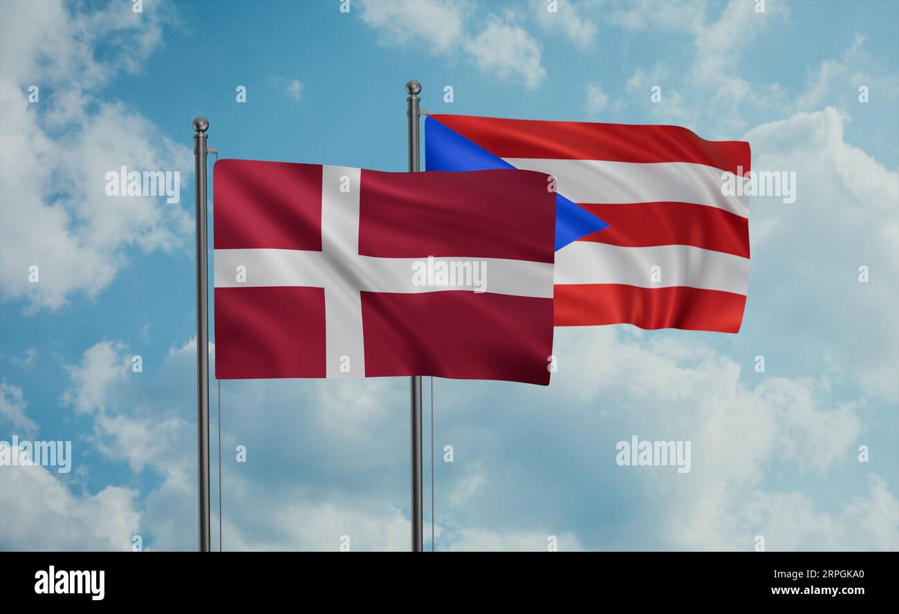 Puerto Rico and Denmark flag waving together in the wind on blue sky ...