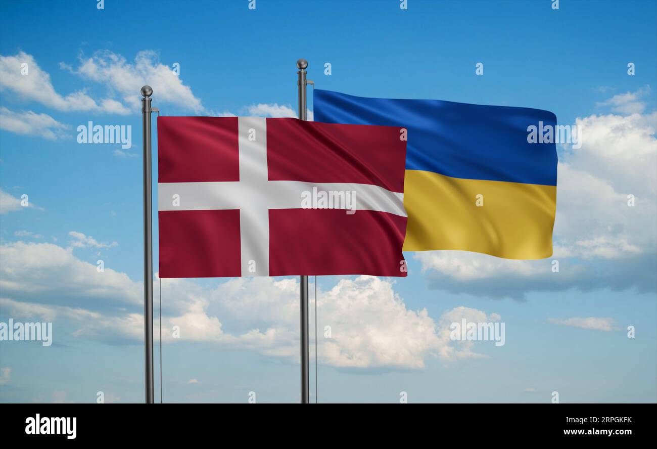 Ukraine and Denmark flag waving together in the wind on blue sky, two ...