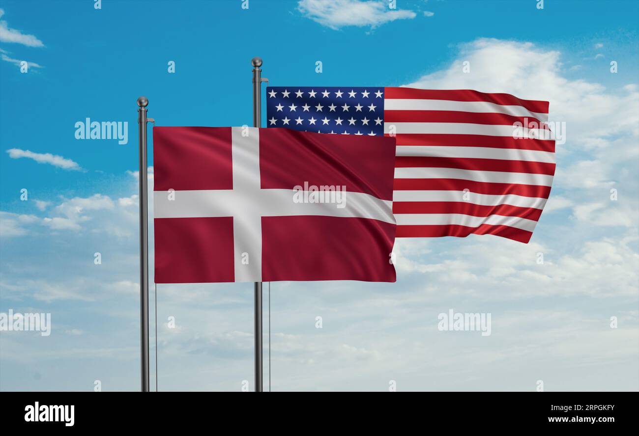 USA and Denmark flag waving together in the wind on blue sky, two ...