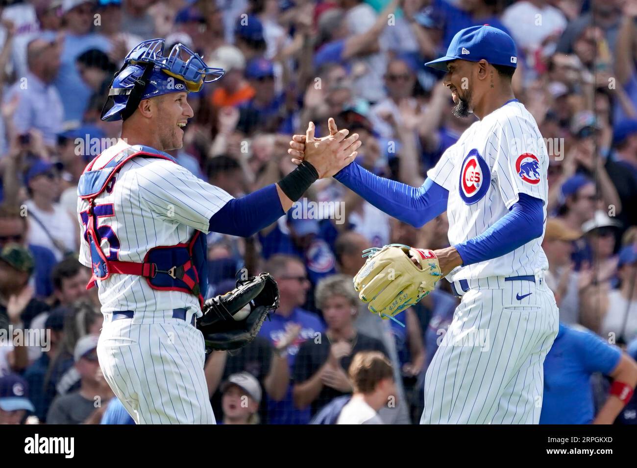 Chicago Cubs catcher Yan Gomes, left, and relief pitcher Jose Cuas ...