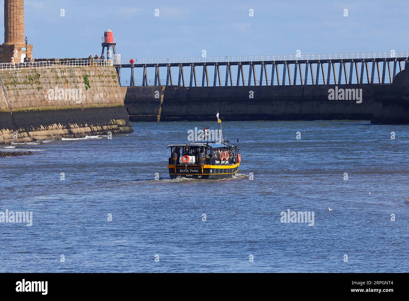 A Pirate Boat with tourists heading out of the harbour in Whitby,North ...