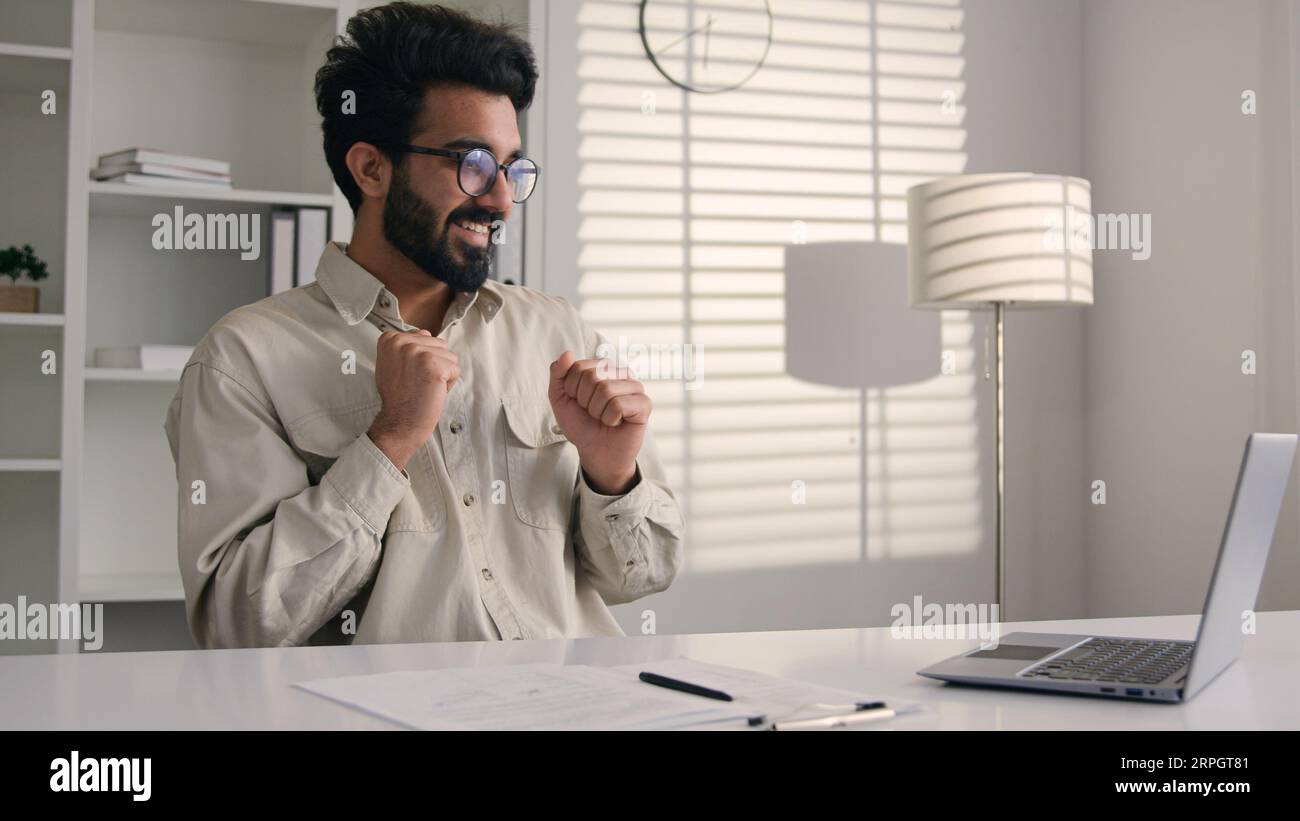 Happy Indian muslim man businessman freelancer Arabian guy celebrate ...