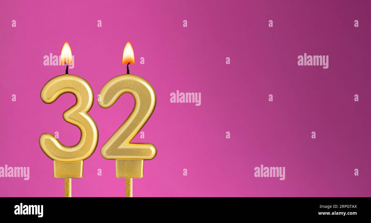 Birthday card with candle number 32 - purple background Stock Photo - Alamy