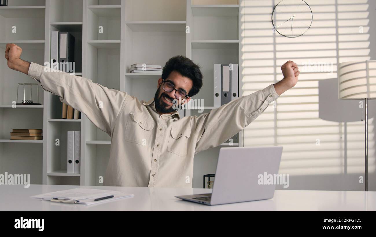 Tired Arabian businessman Indian muslim man working remote happy ...