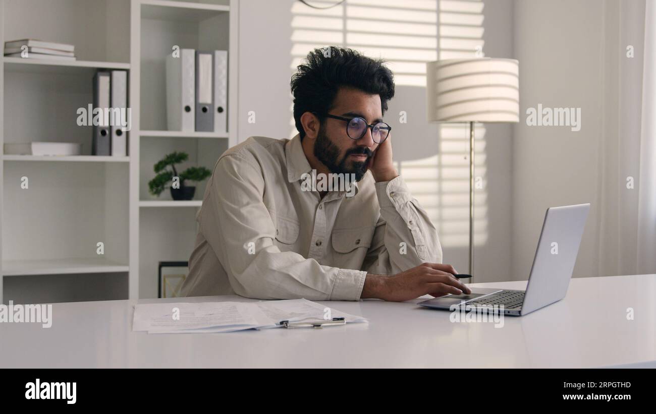 Tired bored Arabian Indian man businessman lazy employee manager boring ...