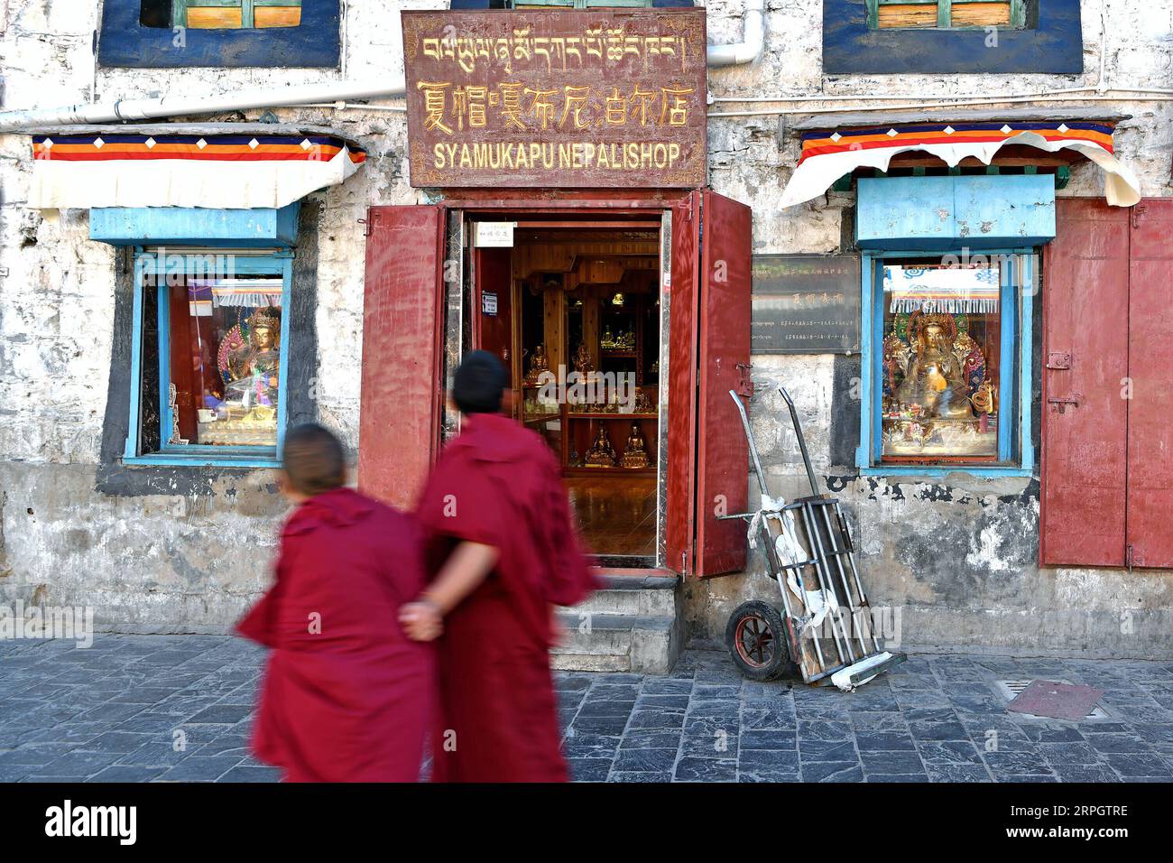 191022 -- LHASA, Oct. 22, 2019 -- Two monks walk past the Syamukapu ...