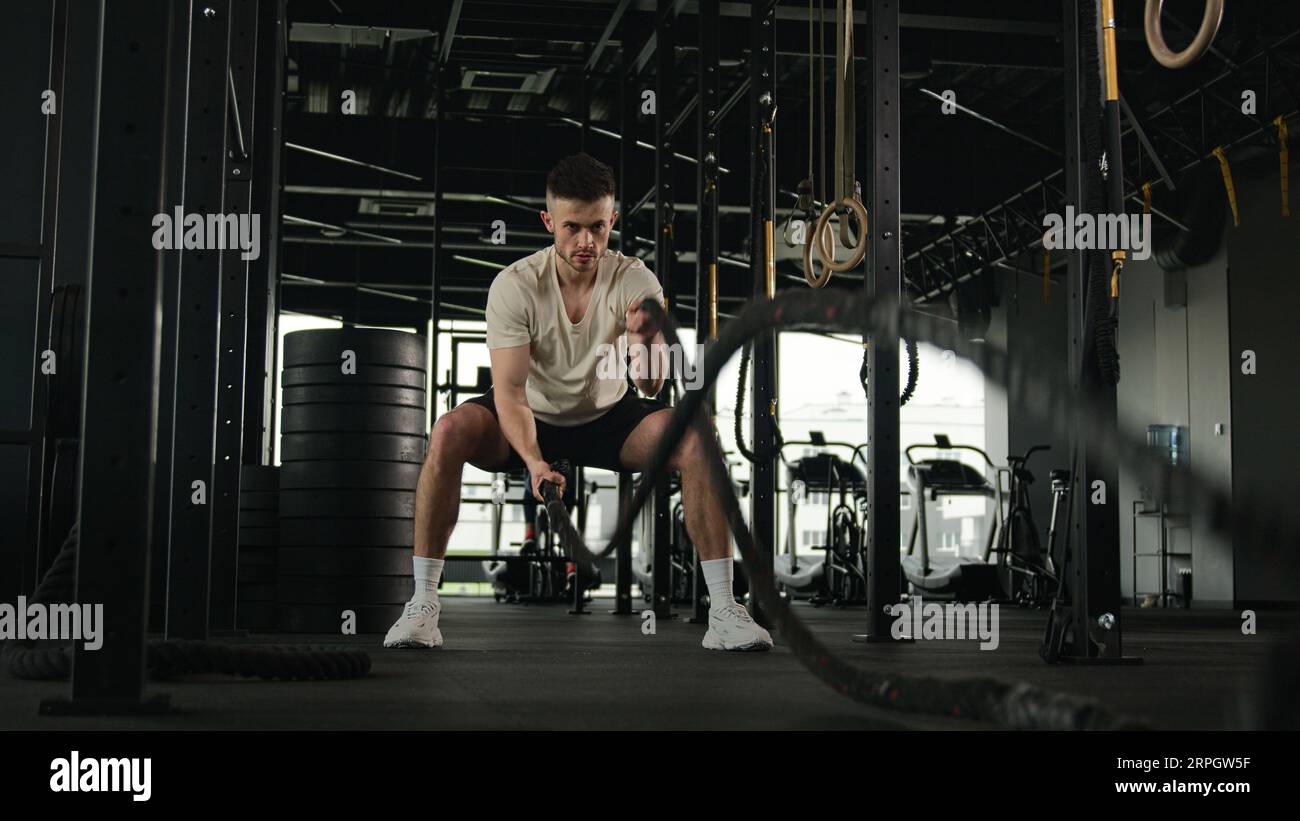 Active powerful muscular fitness instructor Caucasian man sportsman ...