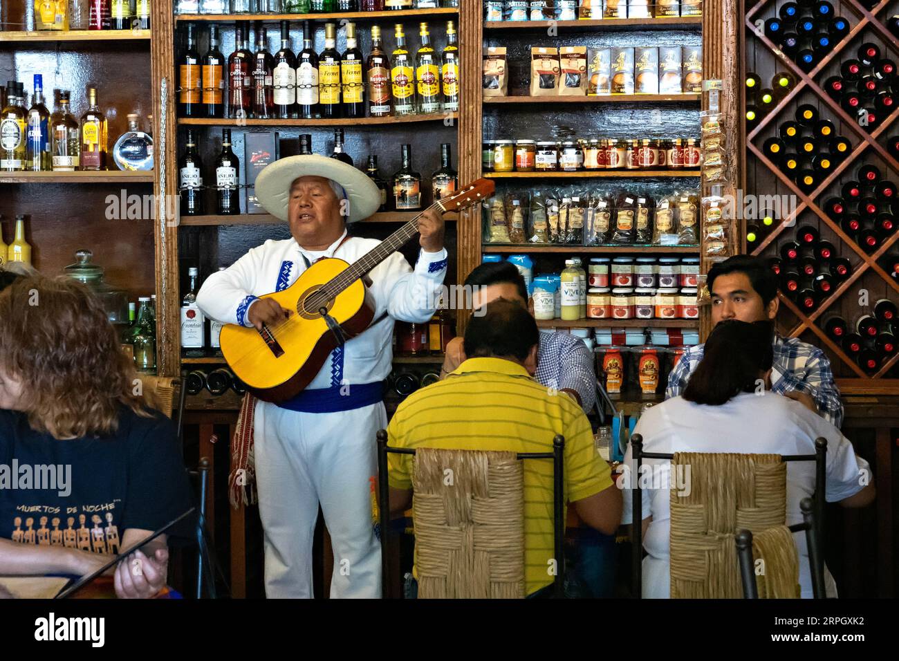 A Mexican mariachi musician plays for customers in La Surtidora ...