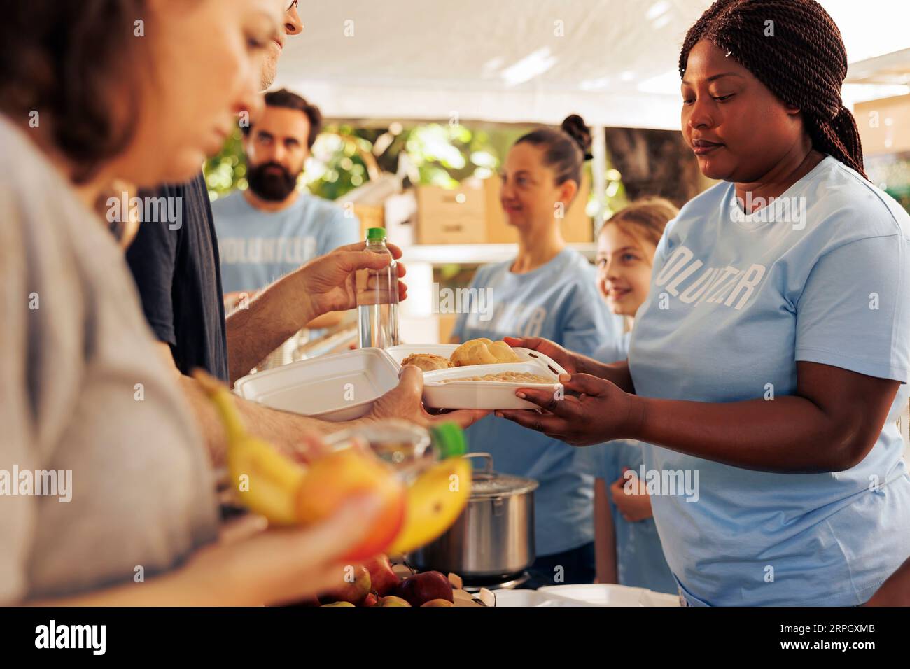 African poverty food sharing hi-res stock photography and images - Alamy
