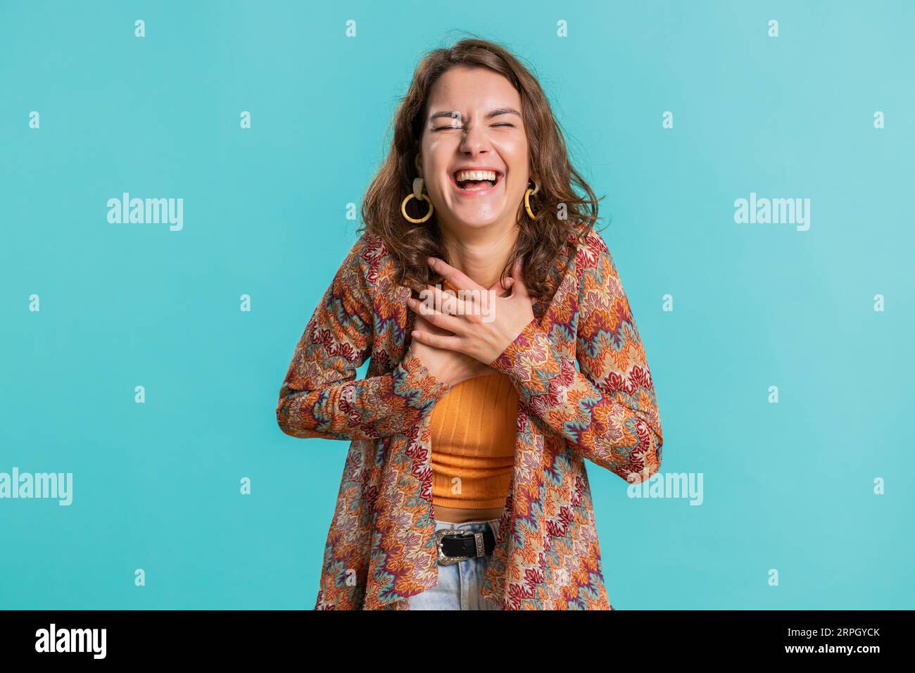 Amused lovely woman pointing finger to camera, laughing out loud ...