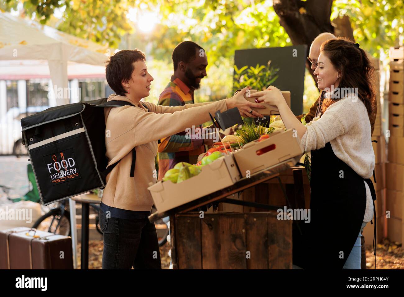Farmers markets and home delivery. Local farmer giving box with fresh ...