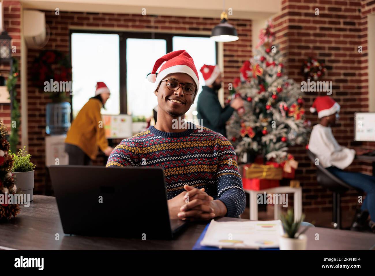 African american worker wearing santa hi-res stock photography and ...