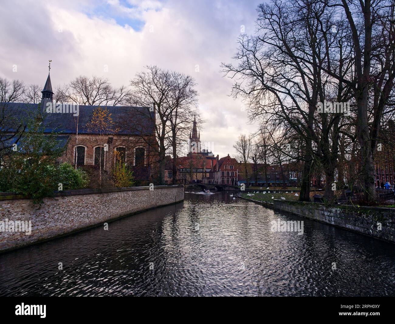 Idyllic canal reflections in medieval city of Bruges, Belgium Stock ...