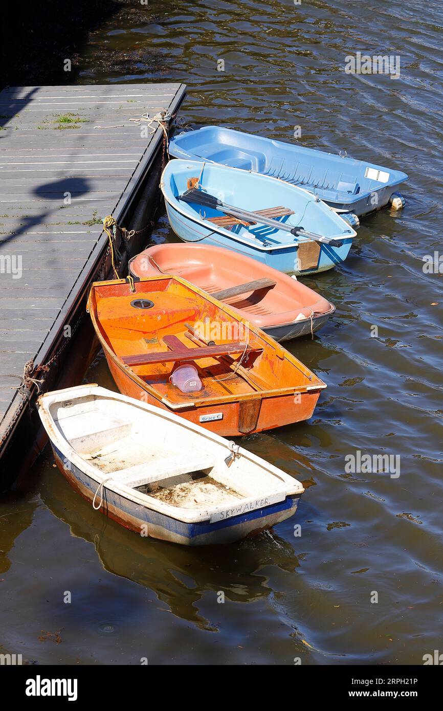 A line of empty rowing boats in Whitby harbour,North Yorkshire,UK Stock ...