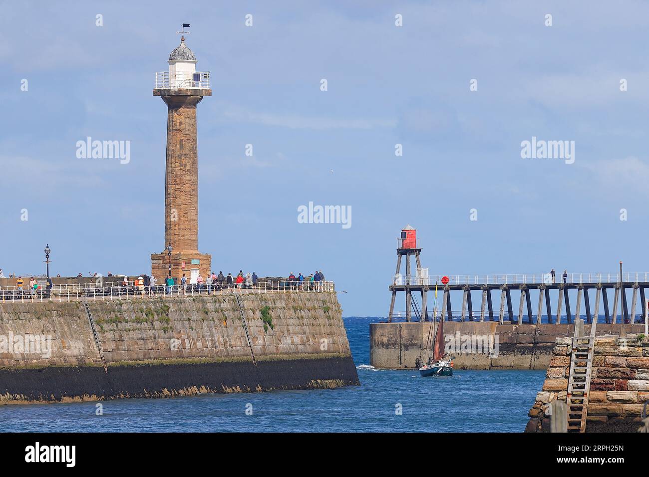 West lighthouse and East Pier beacon in Whitby, North Yorkshire,UK ...