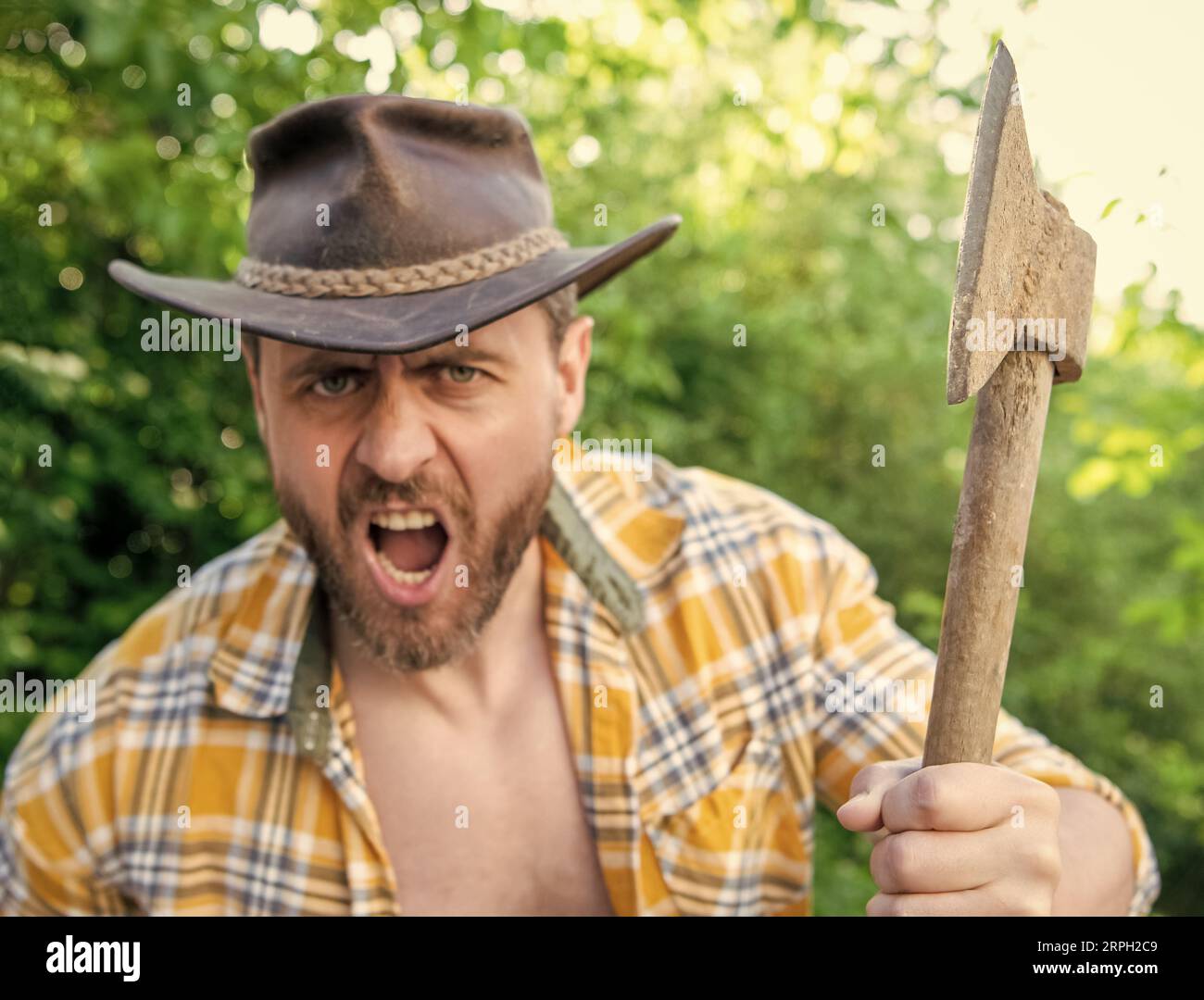 angry lumberjack with axe in selective focus. angry lumberjack with axe ...