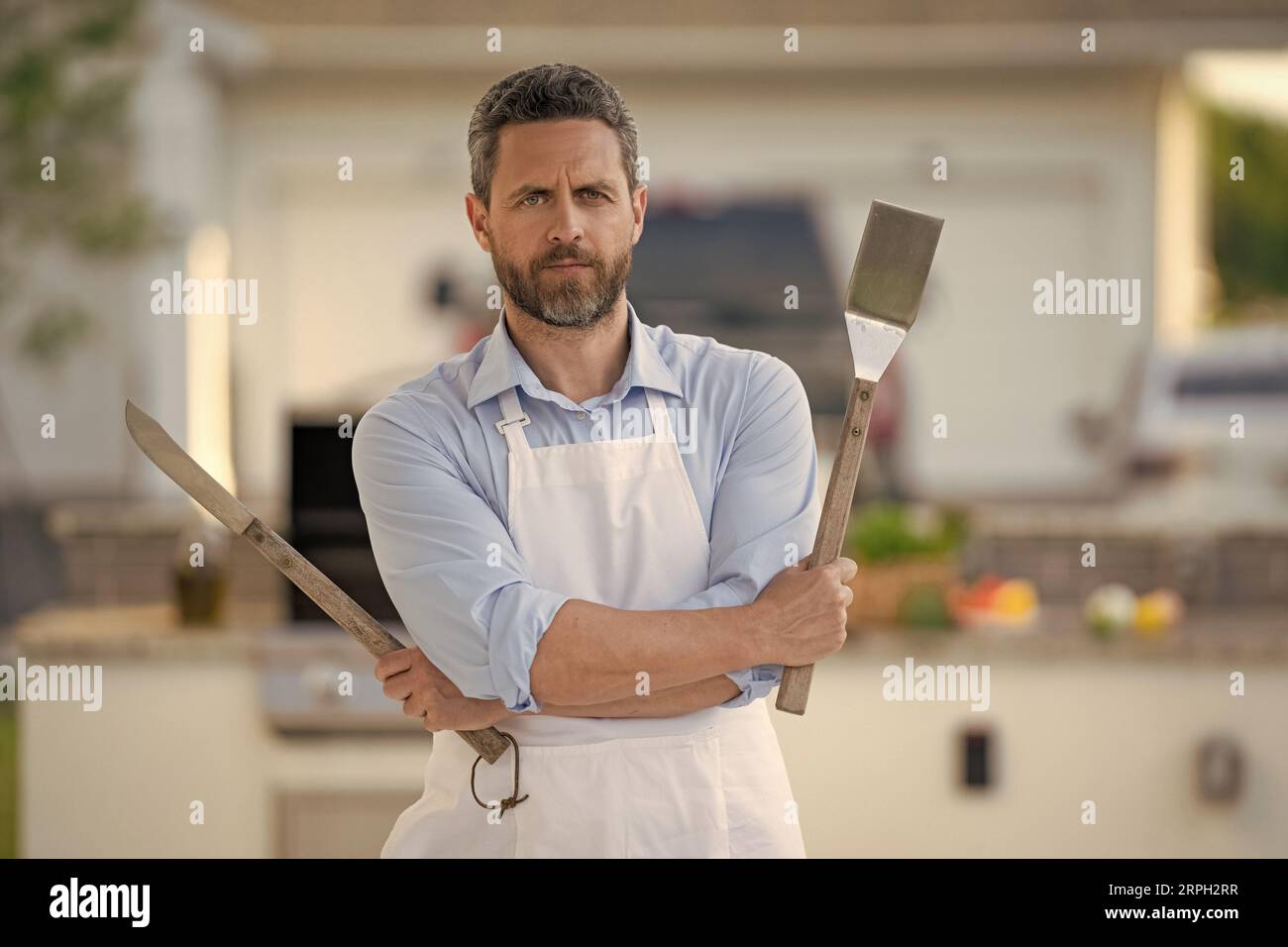 portrait of chef man at barbecue and grill outdoor. photo of chef man ...