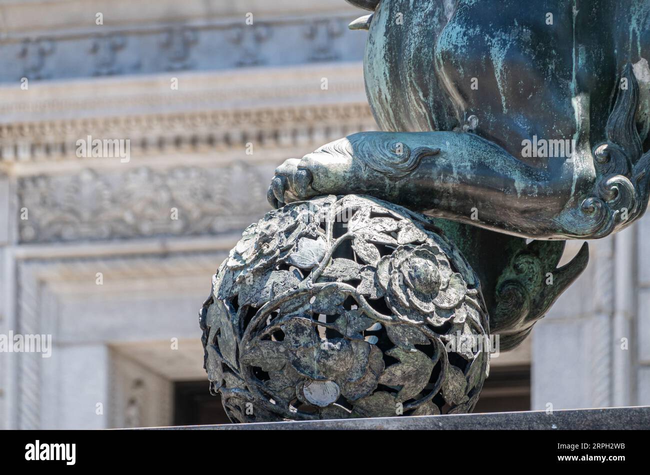 San Francisco, CA, USA - July 12, 2023: Bronze statue of a lion, ball ...