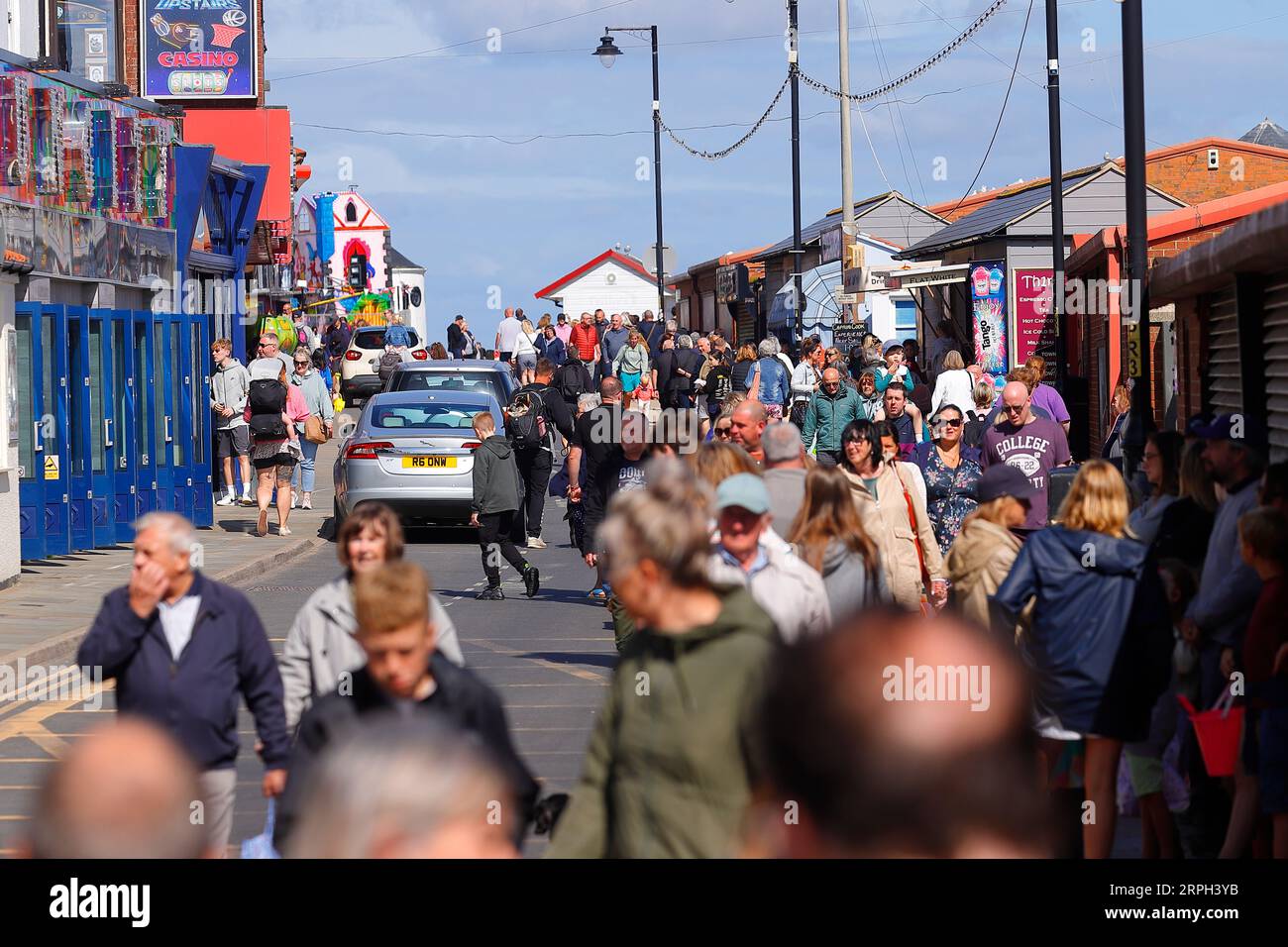 Pier Road in Whitby seen here full of tourists on a busy summers day on ...