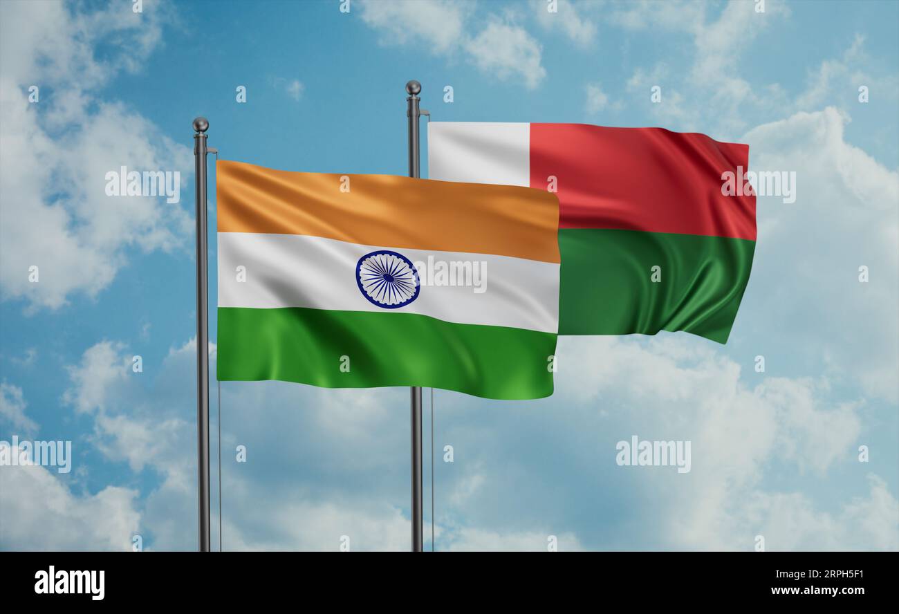 Madagascar flag and India flag waving together on blue sky, two country ...
