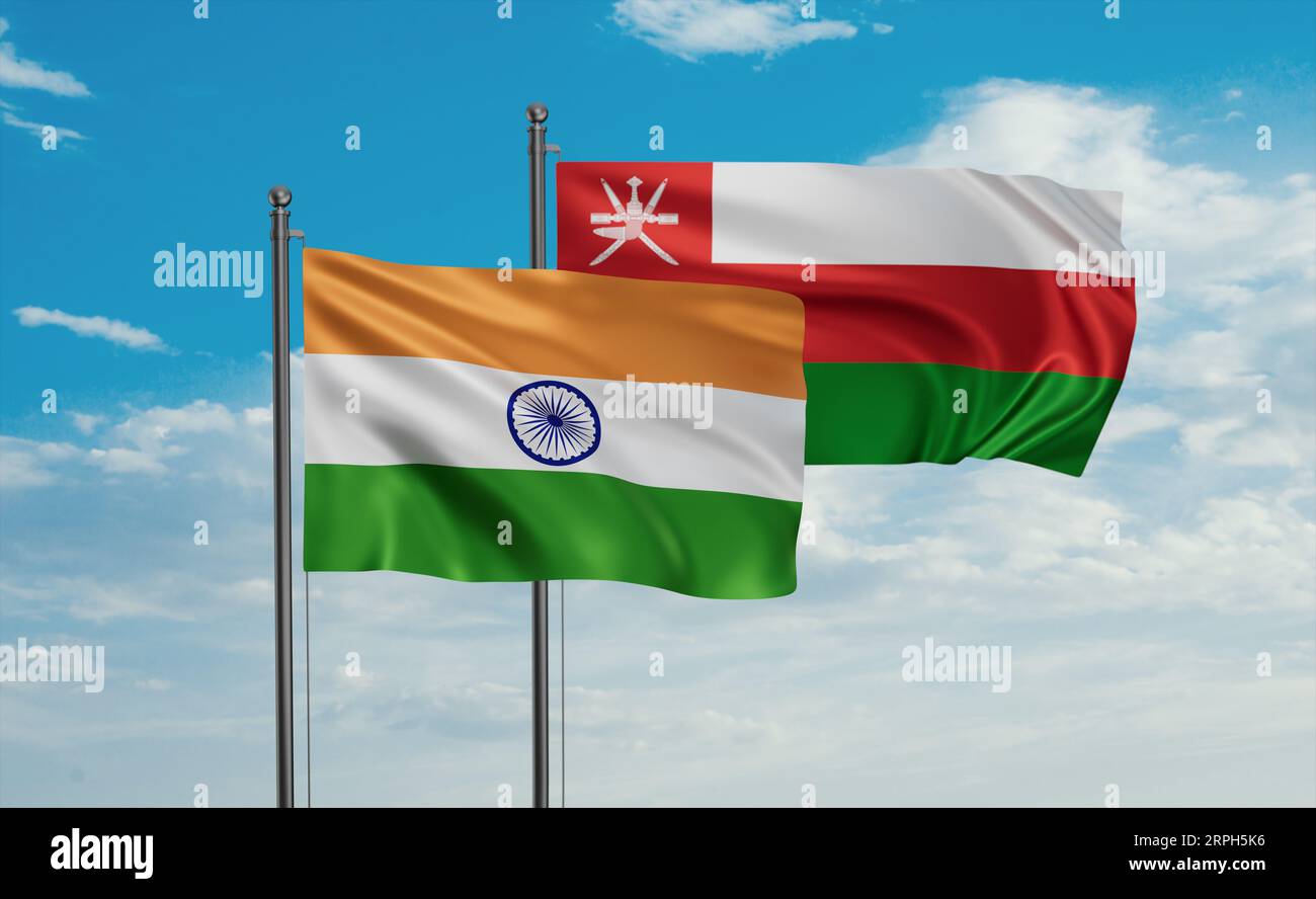 Oman and India flag waving together in the wind on blue sky, two ...