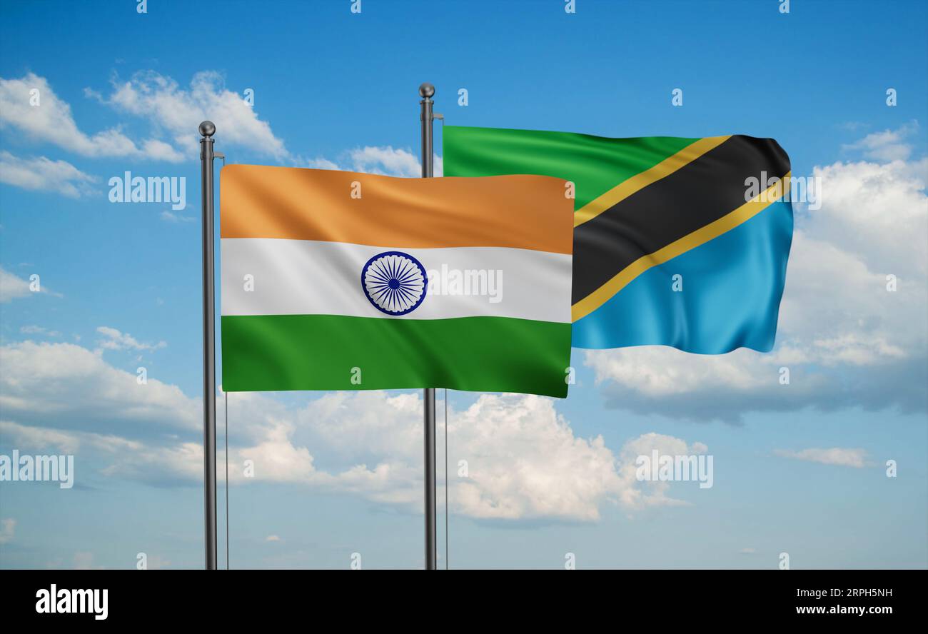 Tanzania and India flag waving together in the wind on blue sky, two ...